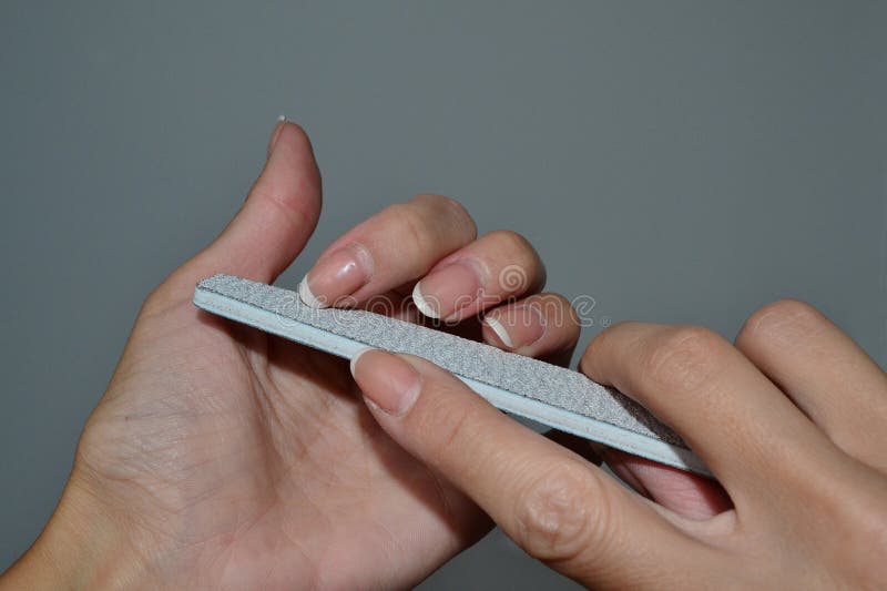 The Girl is Filing Her Nails Stock Image - Image of closeup, girl ...