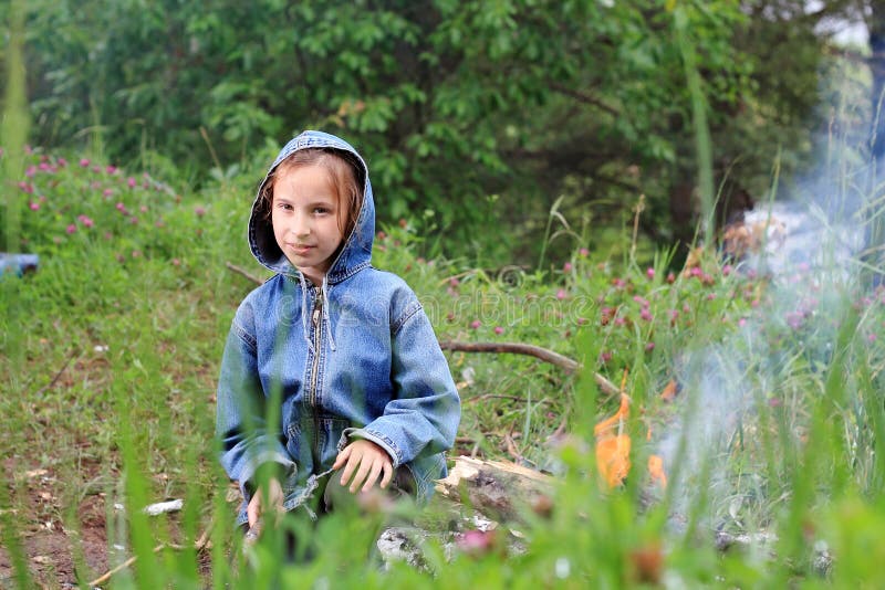 Girl by the fire stock photo. Image of happiness, park - 129625384