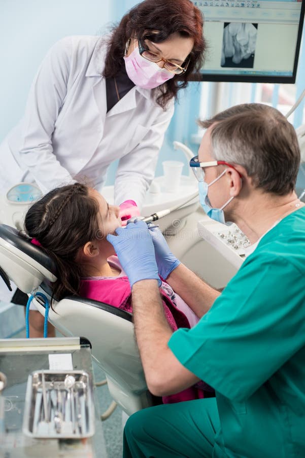 Girl With On The First Dental Visit Senior Pediatric Dentist With
