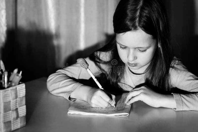 The Girl is a First Grader in the Room Doing Homework Stock Image ...