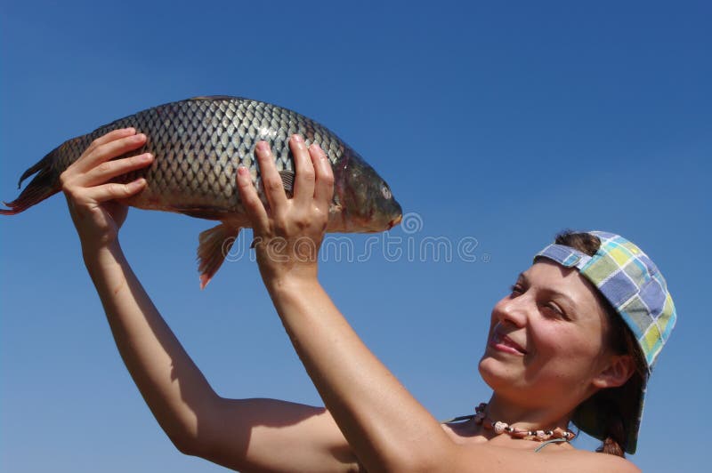 The girl with fish stock image. Image of destinations - 15823545