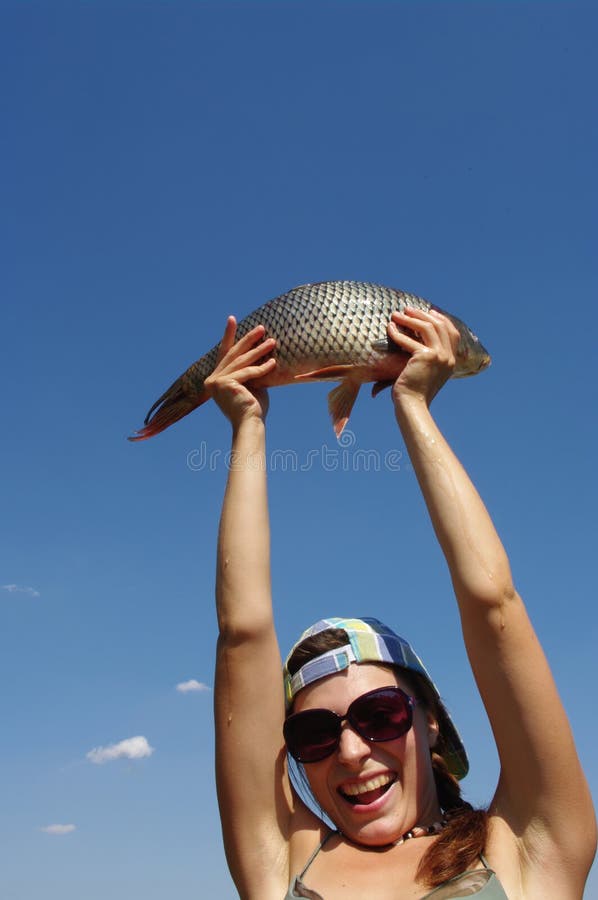A Young Girl Catches a Fish Stock Image - Image of beautiful, portrait ...