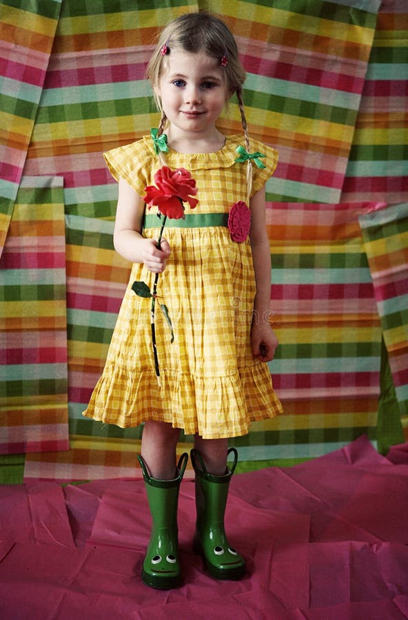 Girl with flower and boots stock image. Image of face - 13471207