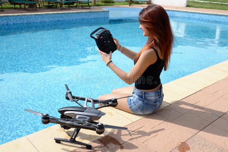 Girl Fly Drone with Remote Control by the Swimming Pool Stock Photo ...