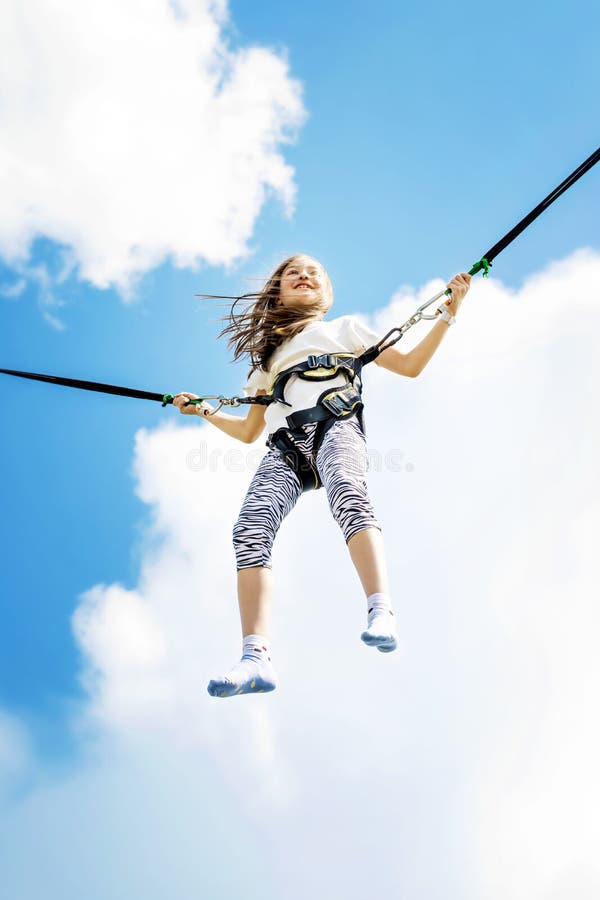 Girl Flying High on Bungee stock photo. Image of authentic - 166575800