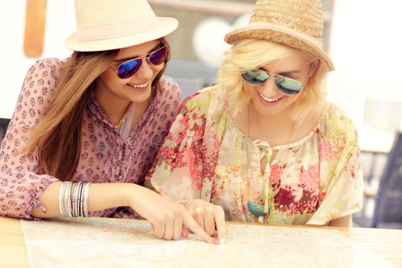 Girl Friends Checking on Map Stock Image - Image of female, guide: 54755533