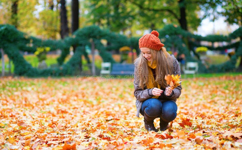 Girl Gathering Autumn Leaves in Park Stock Image - Image of gardens ...