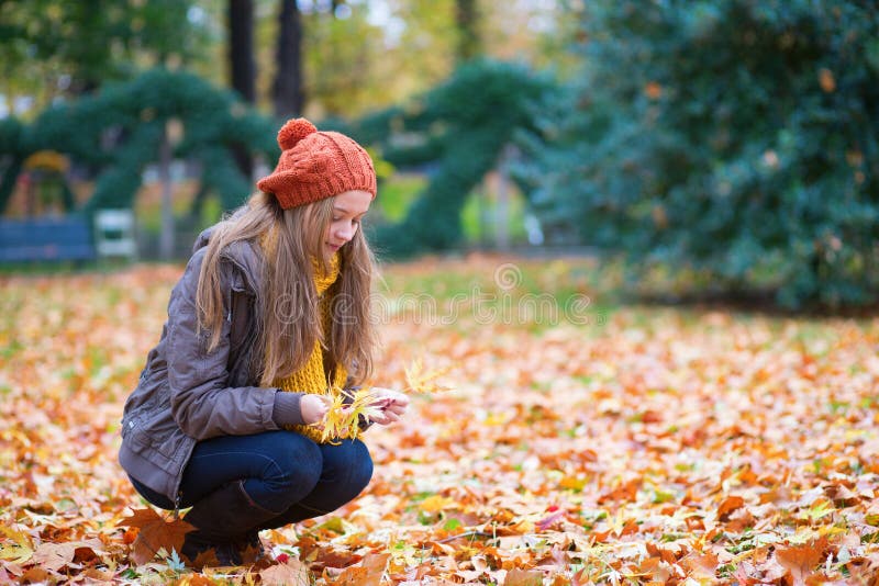 Girl Gathering Leaves on a Fall Day Stock Photo - Image of luxembourg ...