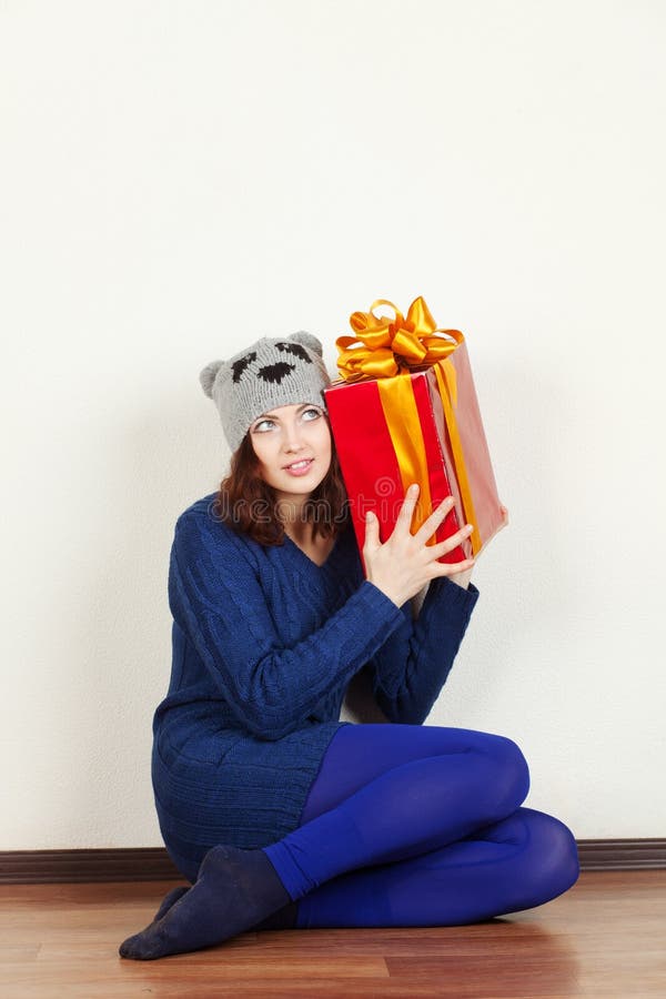 Girl with a gift stock photo. Image of knitted, blue - 23125612