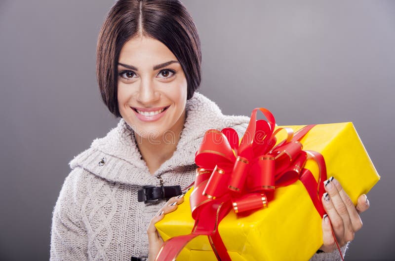 Girl with a gift stock image. Image of beauty, light - 27824753