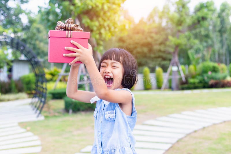Girl Giving a Gift To Someone Special Stock Photo - Image of female ...