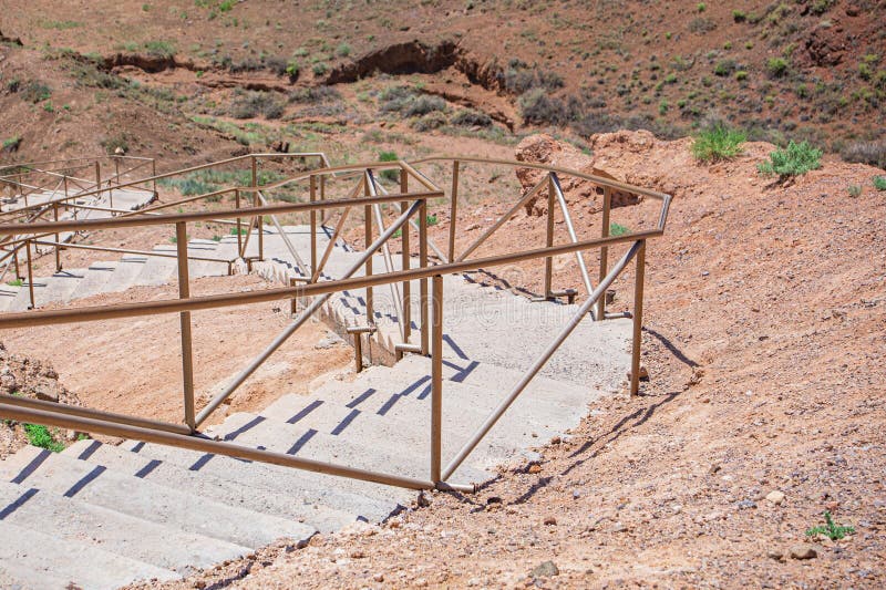 Girl Going Down in Desert Mountains Along Organized Stairs Stock Photo ...