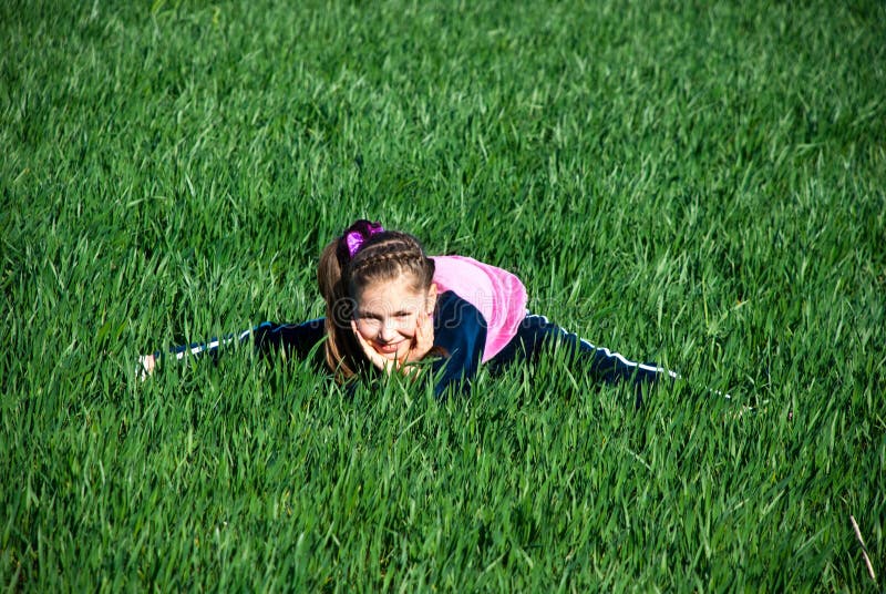 Girl on a grass stock photo. Image of bright, teen, pleasure - 9125298