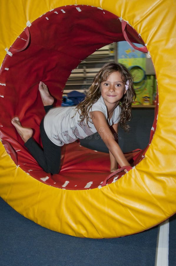 Girl Playing at the Gym Wheel. Stock Photo - Image of development ...