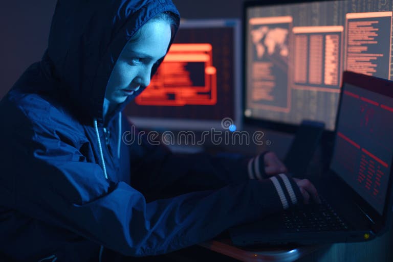 Girl Hacker in a Hood Typing Program Code while Committing a Cybercrime ...