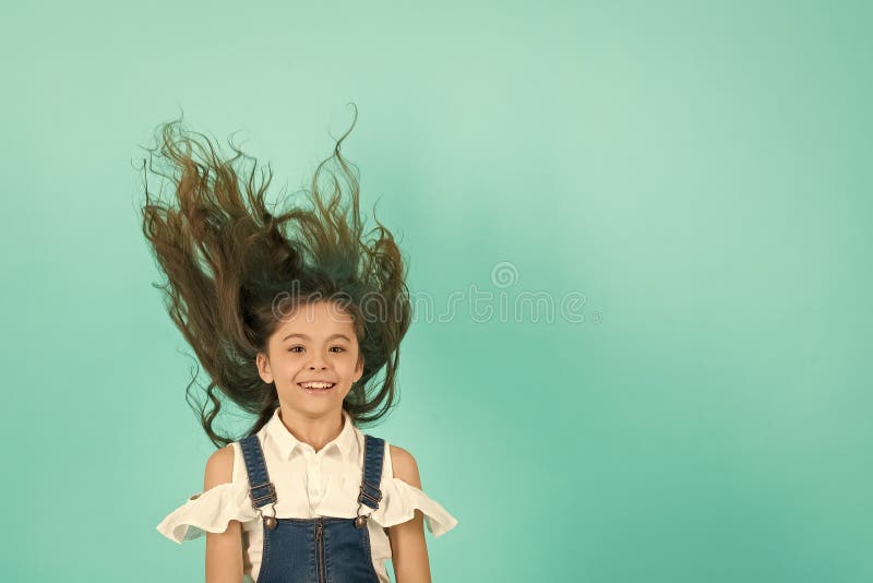 Girl with Hair Blowing in Wind on Blue Background Stock Image - Image ...