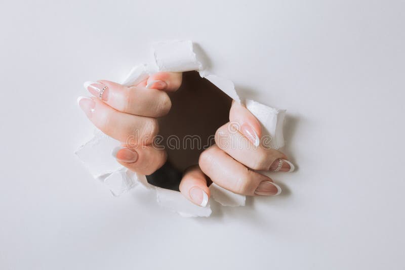 Girl Hand Breaks White Paper and Shows a Gesture Stock Image - Image of ...