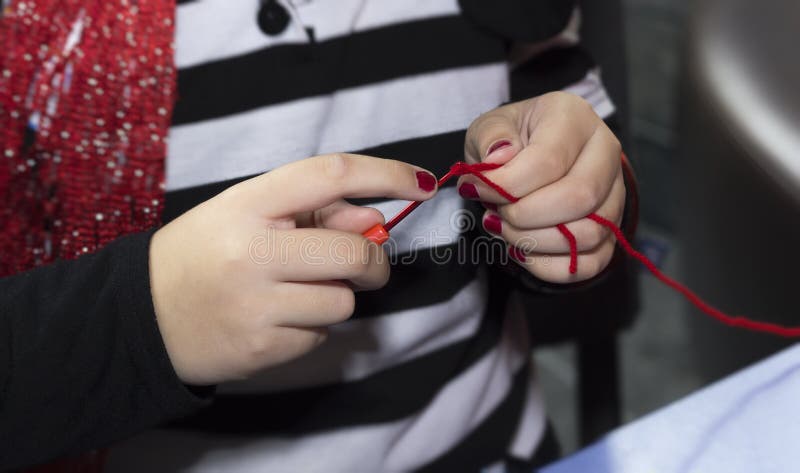 Girl Hands Knitting with Crochet Hook and Red Yarn Stock Image - Image ...
