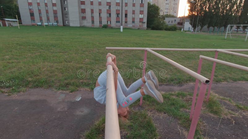 Girl Hanging on the Bar stock video. Video of training - 228443155