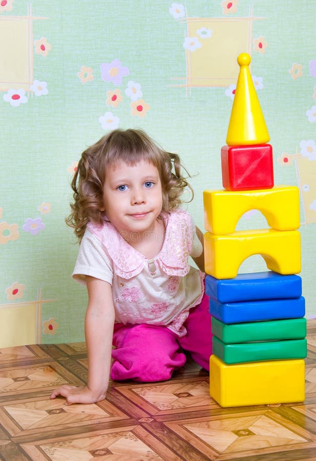 The Girl Has Built a Tower Out of Blocks Stock Photo - Image of babe ...