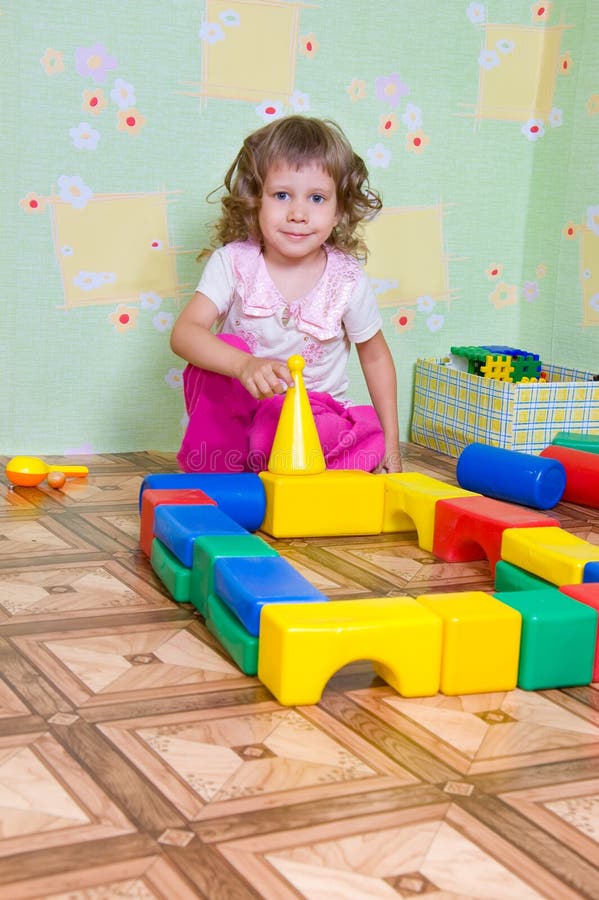 The Girl Has Built a Tower Out of Blocks Stock Photo - Image of home ...