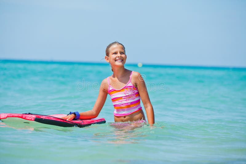 Girl Has Fun with the Surfboard Stock Image - Image of face, beautiful ...