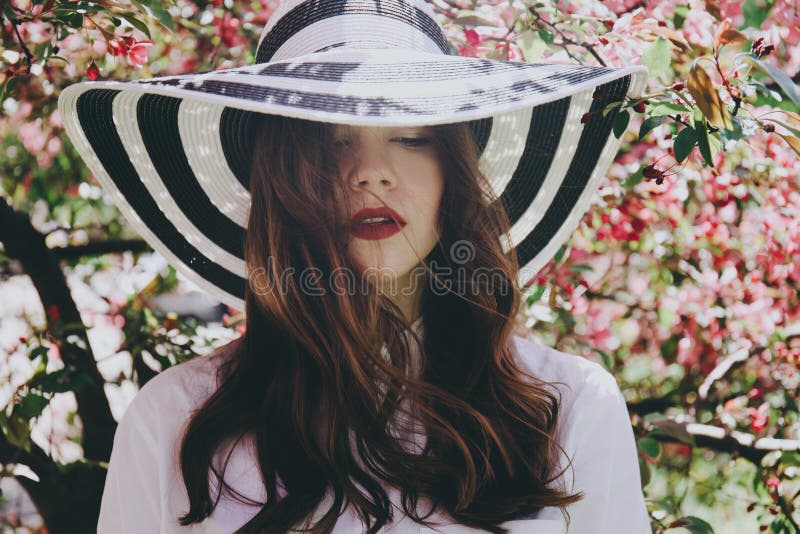 Girl in a Hat in Blossoming Trees. Stock Photo - Image of femininity ...