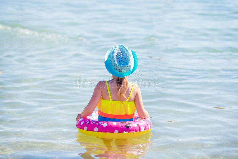 A Girl Floating Ring in the Sea Stock Photo - Image of kids, childhood ...
