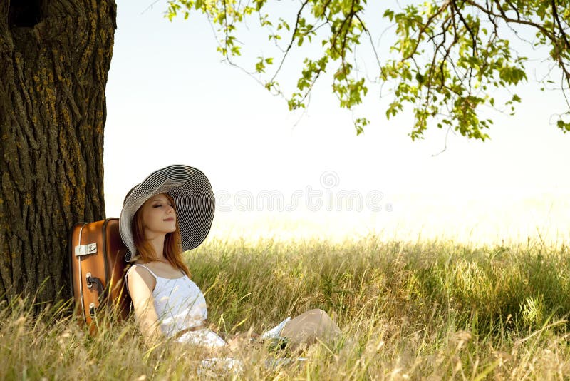 Girl in Hat Sitting Near Tree at Countryside. Stock Image - Image of ...