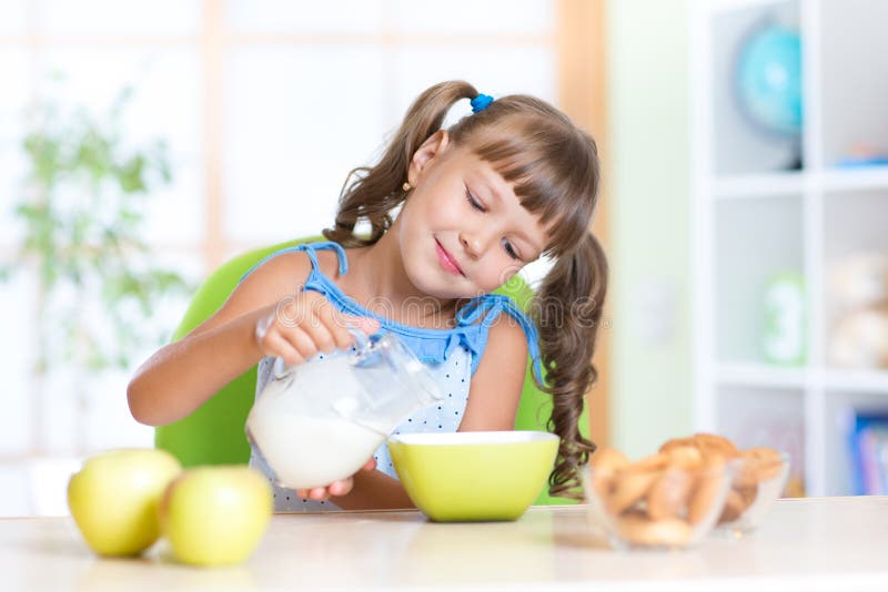 Girl having breakfast stock image. Image of hungry, home - 59459711