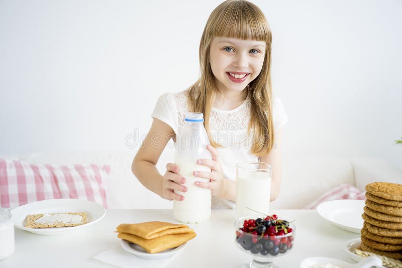 Girl having breakfast stock image. Image of dairyproduct - 104947899