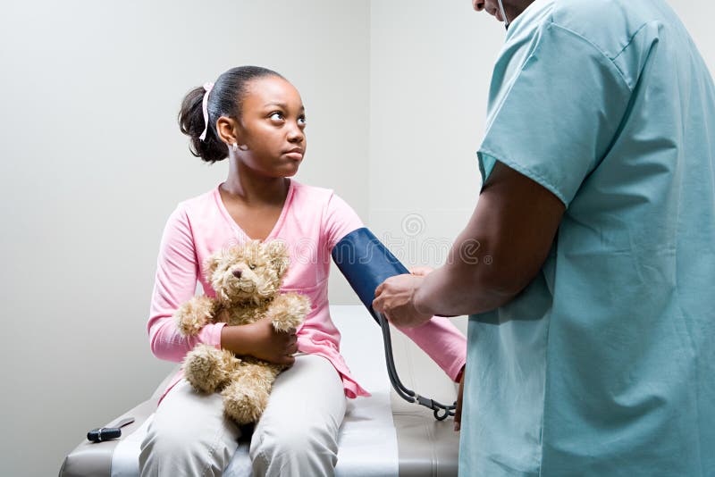Girl having a check up stock photo. Image of holding - 62563314