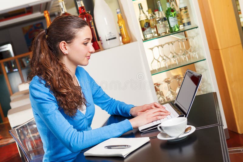 Girl Having a Coffee Break and Working on a Computer Stock Photo ...