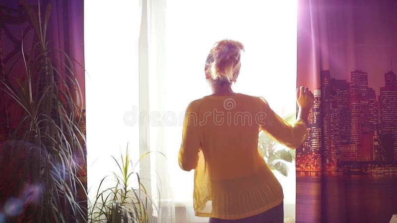 Girl Having Fun Dancing at the Window in the Sunlight Stock Video ...