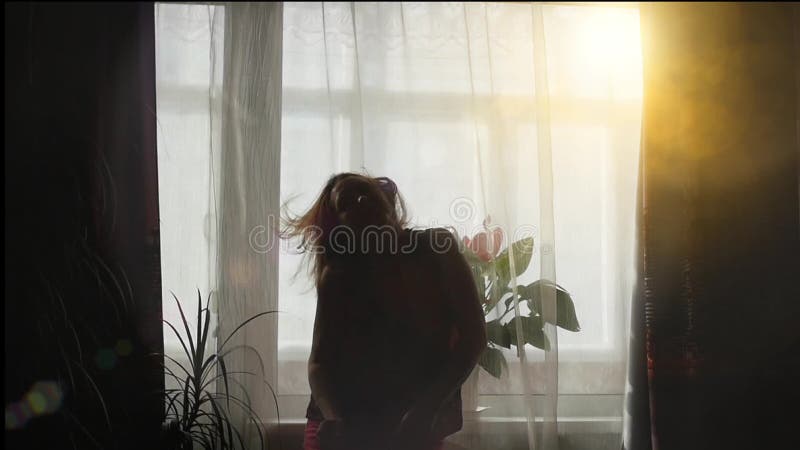 Girl Having Fun Dancing at the Window in the Sunlight Stock Footage ...