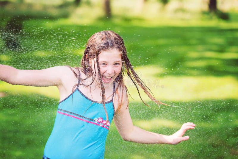 Girl Drinks Spring Water from Fountain. Drinking Mineral Water in Fresh ...