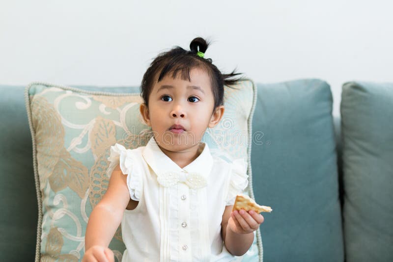 Girl having her snack stock photo. Image of cute, innocence - 56605024