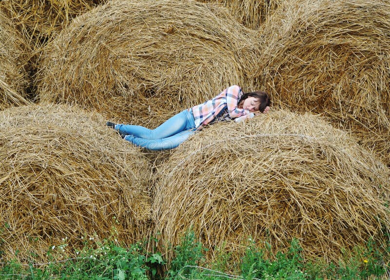 The girl on hay. stock photo. Image of haystack, healthy - 69435740
