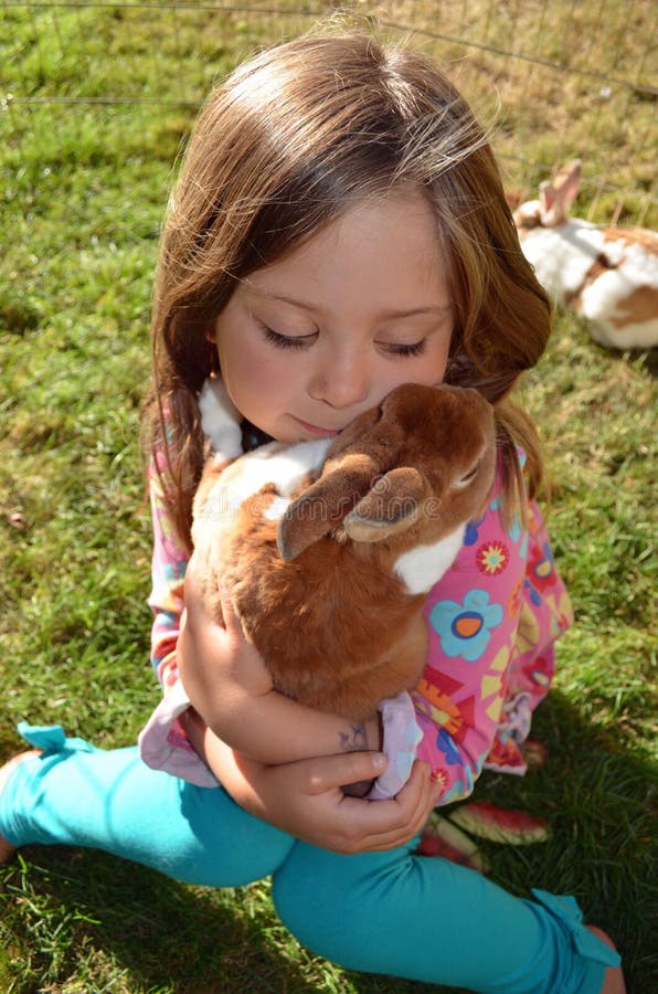A girl and her rabbit stock photo. Image of cuddle, child - 27894478