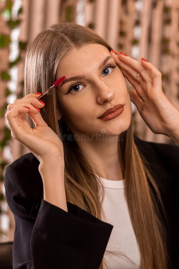 A Girl in Her 20s is Styling Her Eyebrows Stock Photo - Image of model ...