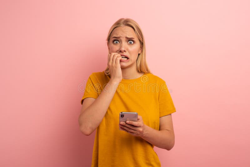 Girl with Her Smartphone. Scared and Afraid Expression Stock Image ...