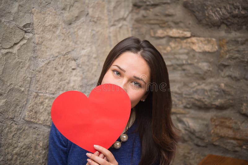 Girl Hiding Behind a Sign in the Form of Heart Stock Image - Image of ...