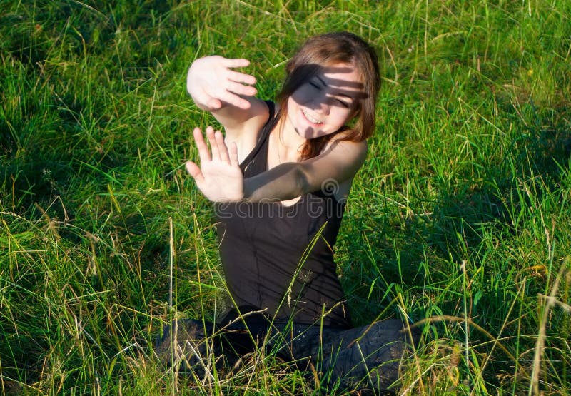 Girl hiding from sun stock image. Image of lovely, field - 34299619