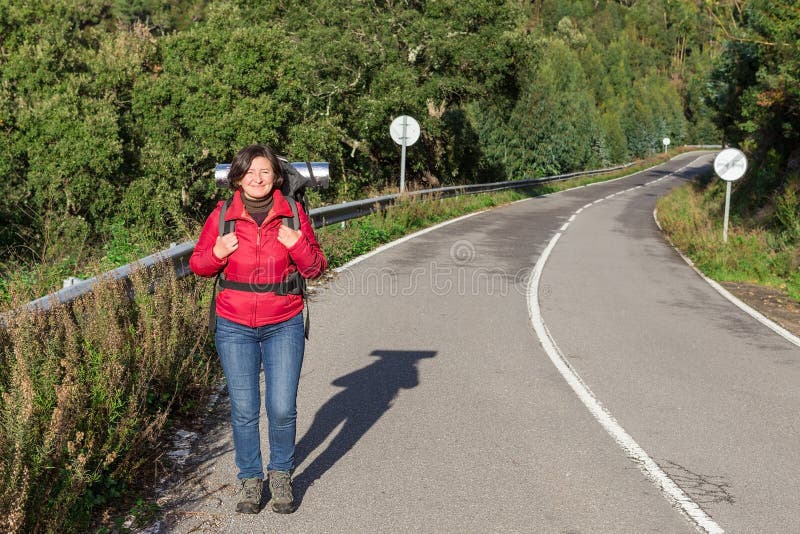 Girl on the Highway with a Backpack Going Camping. Stock Photo - Image ...