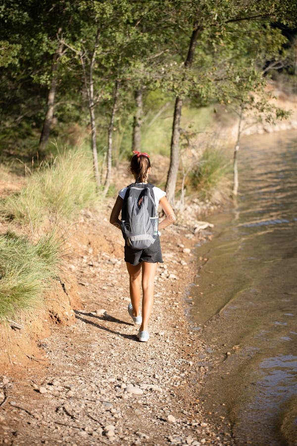 A girl hiking by the swamp stock photo. Image of enjoy - 194158012