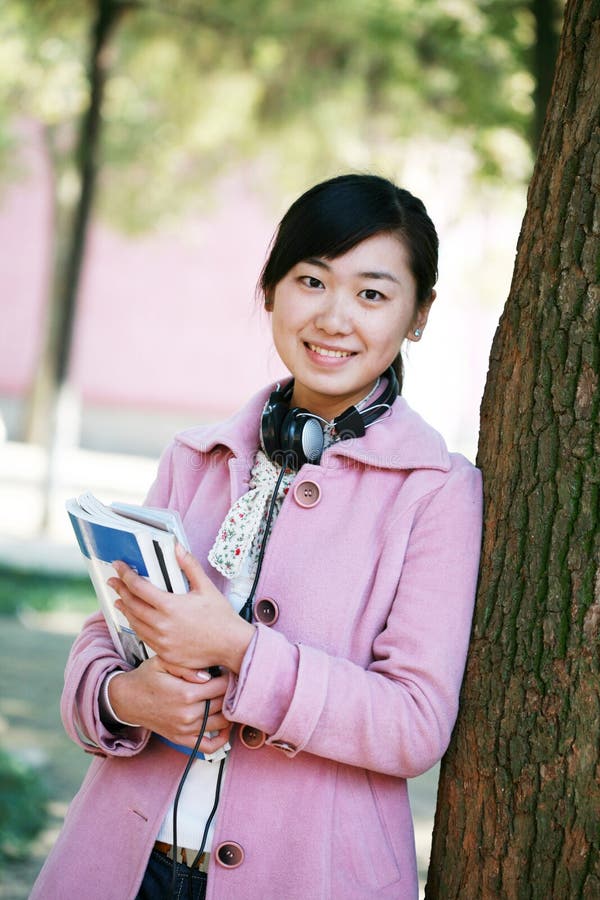 Girl hold headset and book stock photo. Image of smile - 7587418