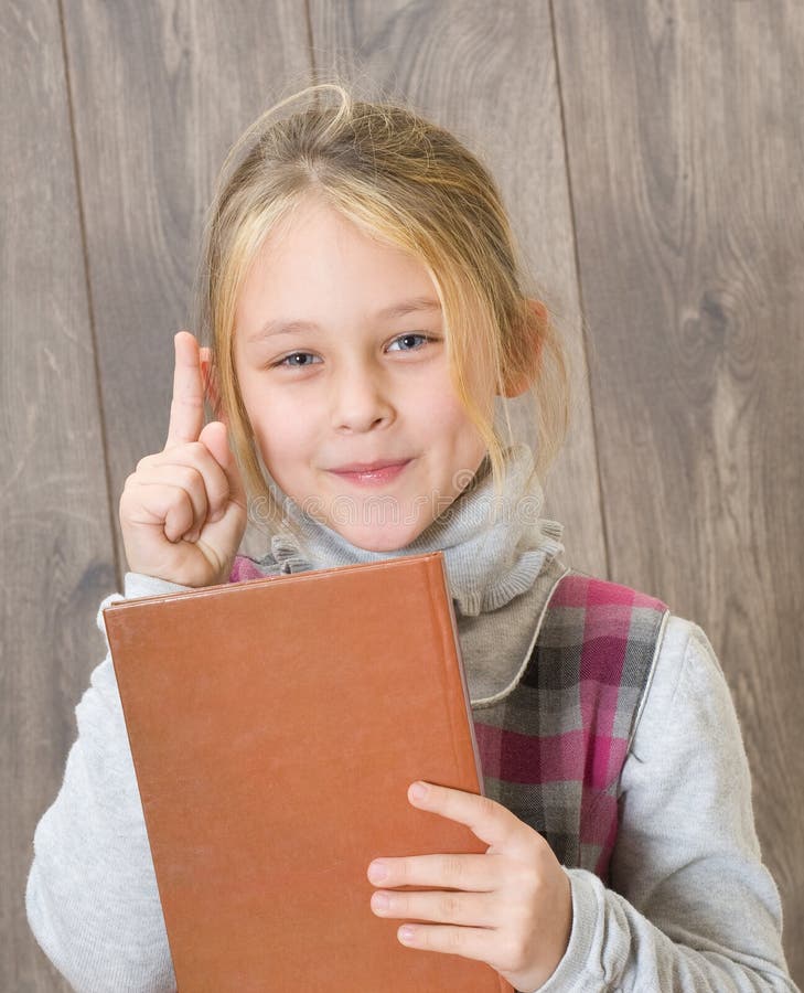 Girl holding a book stock photo. Image of holding, book - 36143524