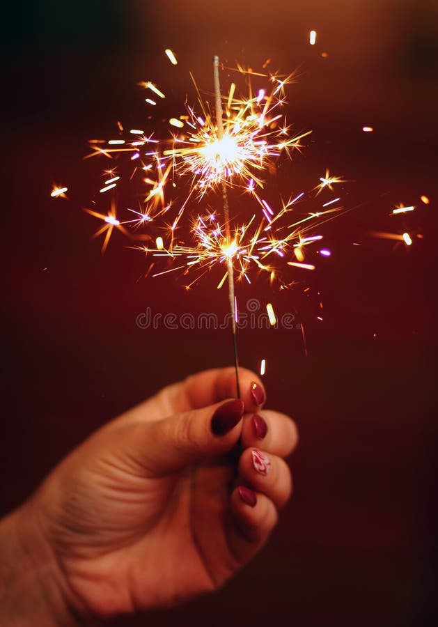 Girl Holding a Burning Sparkler Firework in Her Hand. Stock Photo ...