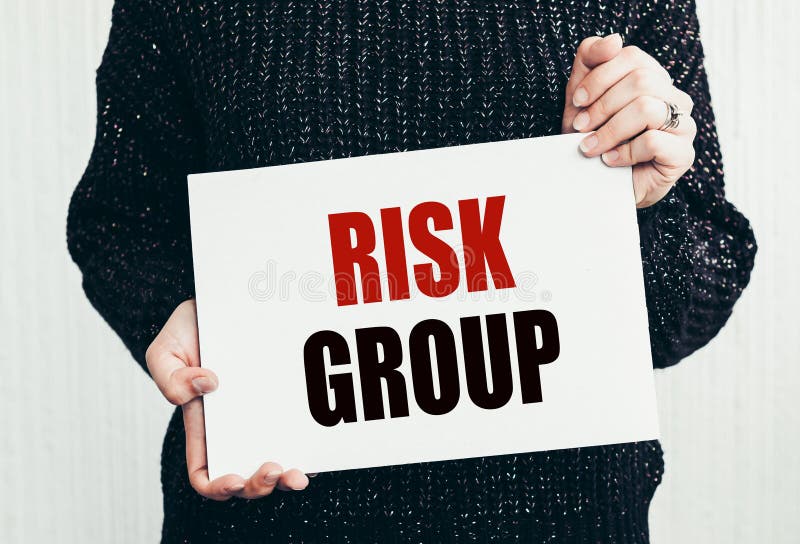 Girl Holding a Card with Text RISK GROUP Stock Image - Image of ...
