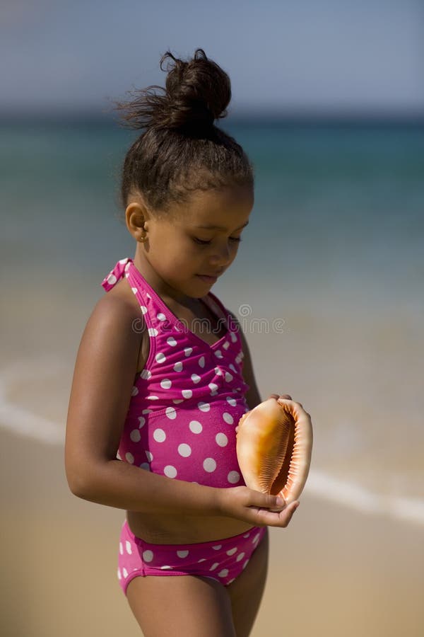 Girl Holding Conch Shell Next To Her Ear. Stock Image - Image of colour ...